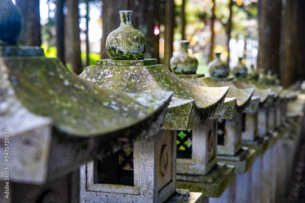 Japanese stone toro lanterns at shrine entrance Stock Photo | Adobe Stock