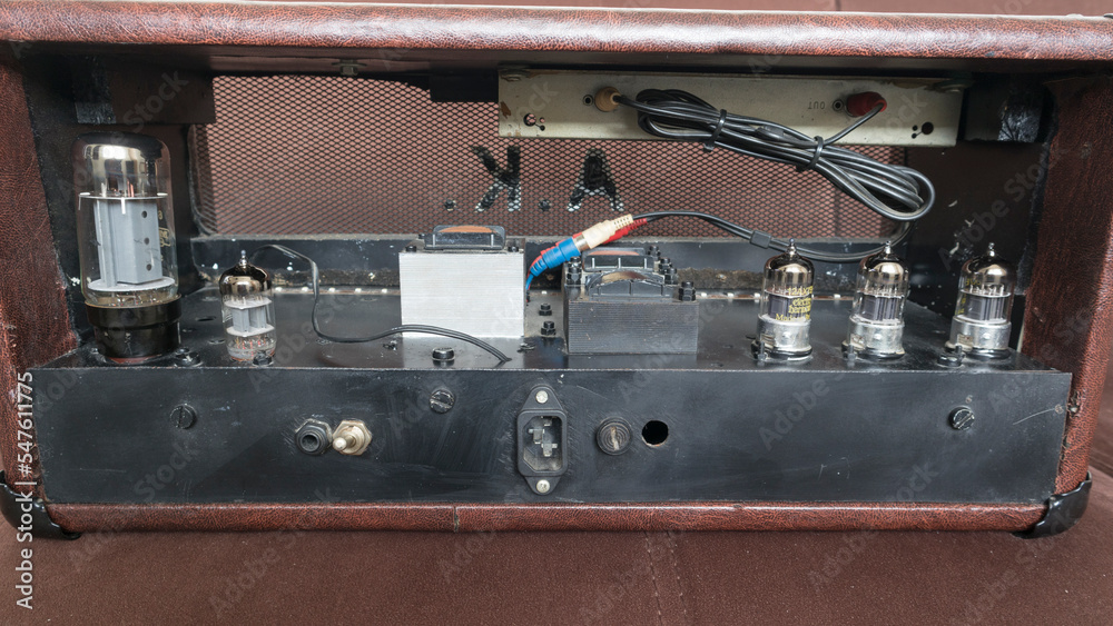 handcrafted brown leather covered amp head in the background 6l6 power ...
