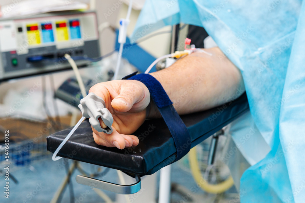 Arm of patient with drip under anesthesia during operation. Stock Photo ...