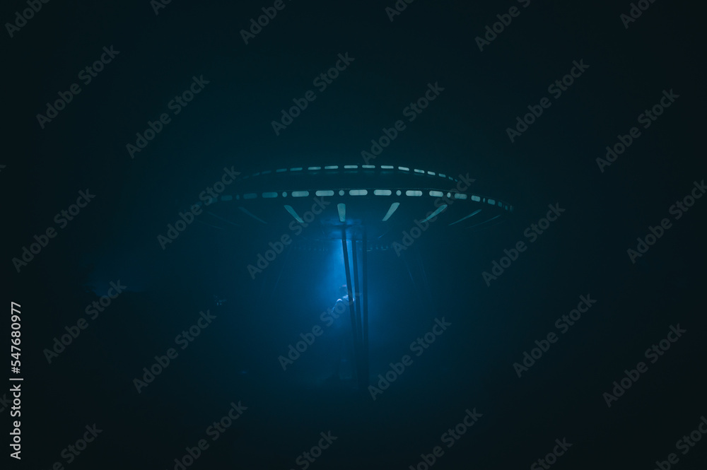 Alien ship UFO in fog at night in blue light. The alien ship landed on the ground. Stock Photo ...
