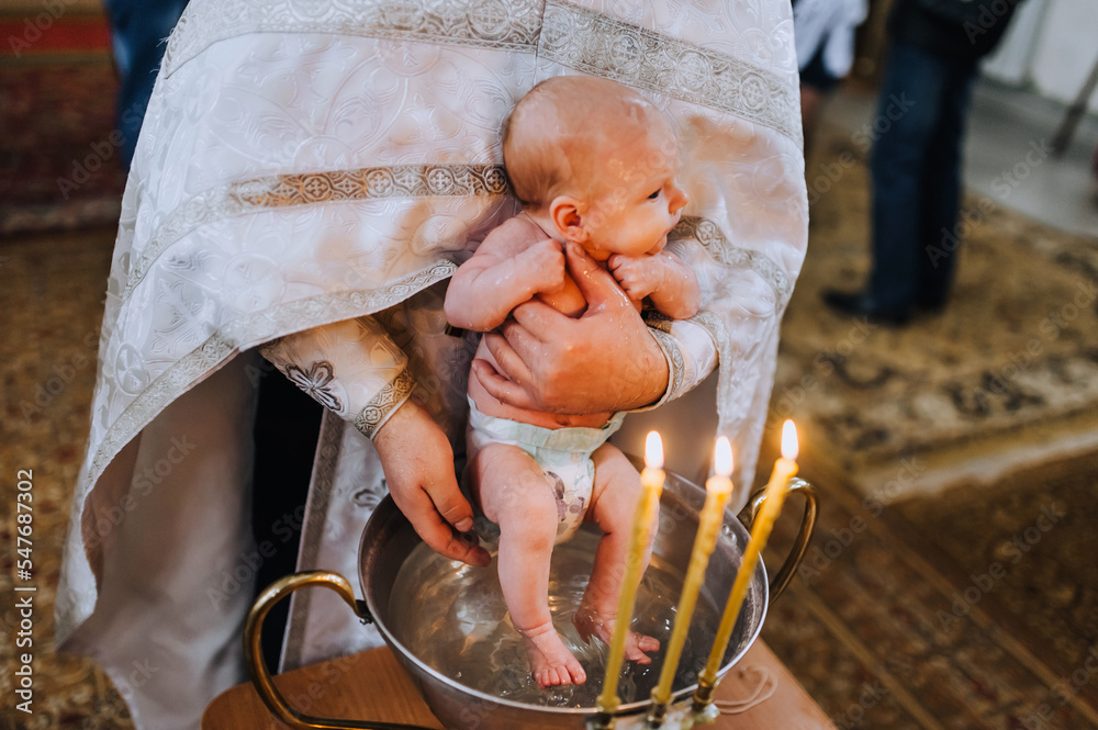 A male Christian priest in a church conducts a sacred rite, a ritual ...