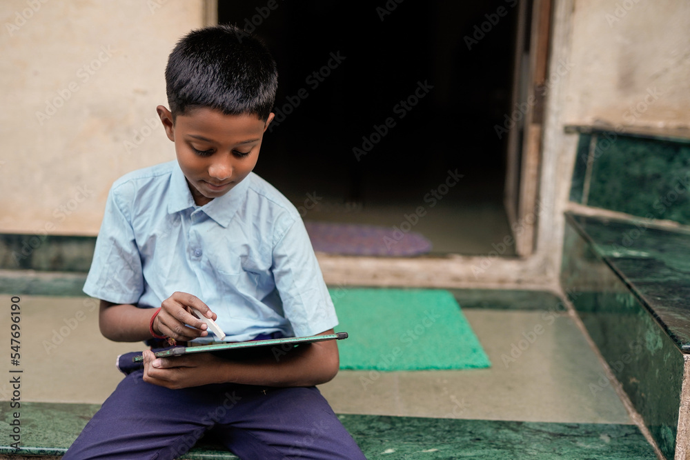 Indian child writing or holding Chalkboard Stock Photo | Adobe Stock