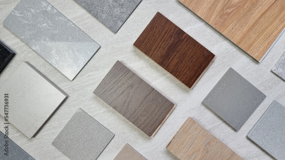 samples of material including wooden engineering flooring tiles, grainy ...