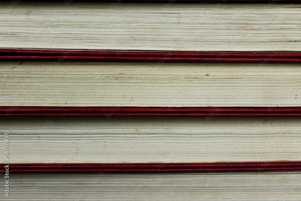 side view of stacked books with yellowed pages Stock Photo | Adobe Stock