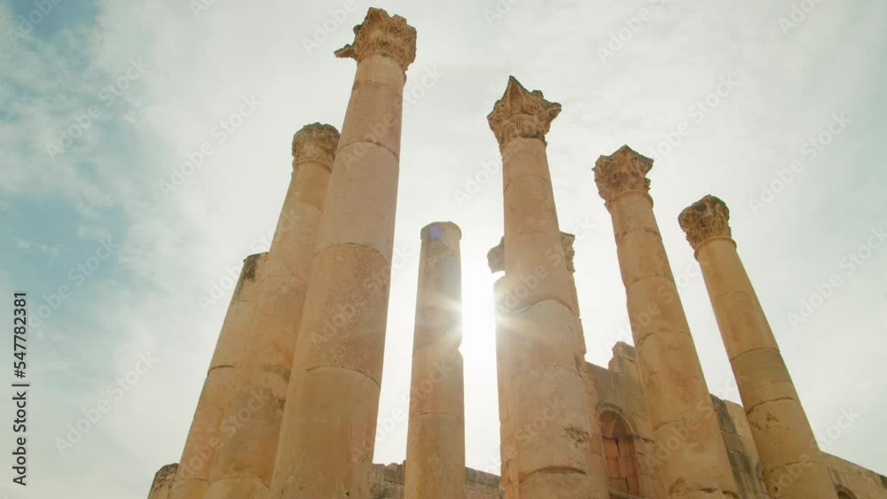 Bottom view of Zeus Temple columns among sunshines in Jerash, Jordan ...