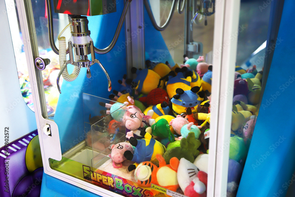 Electronic claw machine to grab stuffed animals. Claw machine. Arcade ...