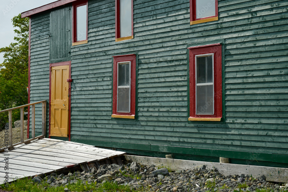 A ramp style entrance to a vibrant and colorful storage building. The ...