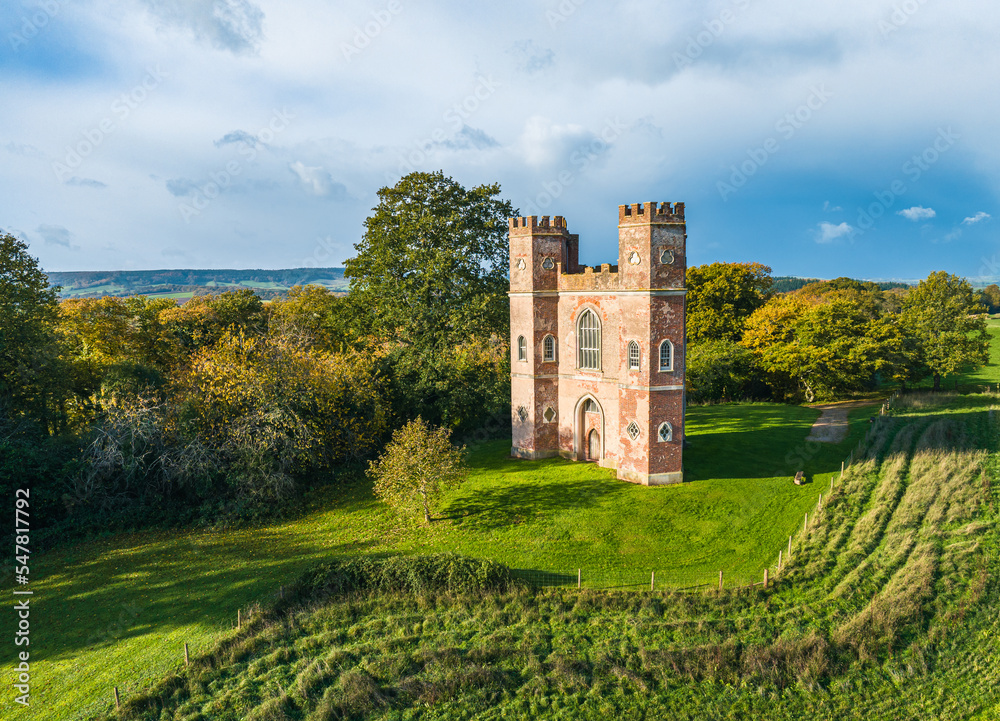 The Belvedere Tower over Powderham Park from a drone in Autumn Colors ...