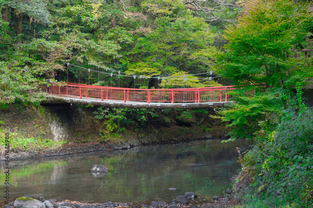 Beautiful scenery of Kikuchi Keikoku with river water and retro red ...