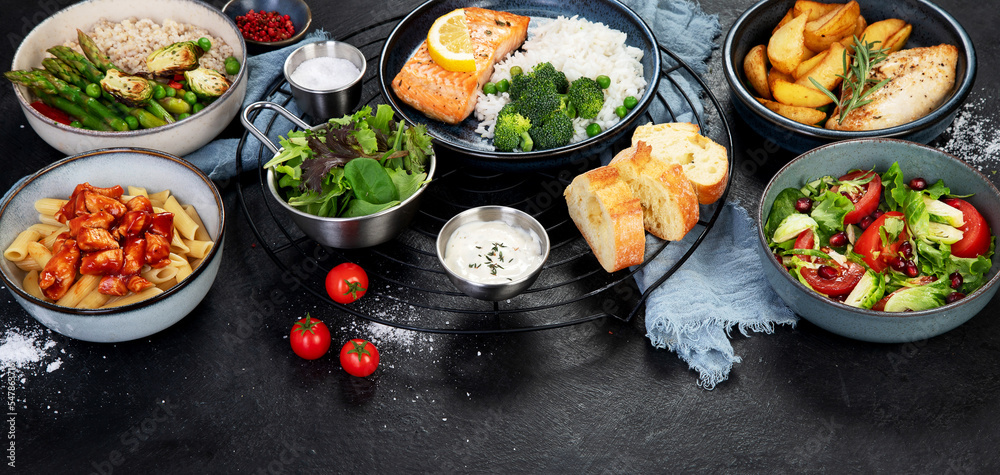 Table of various healthy food dishes. Healthy food assortment. Dieting ...