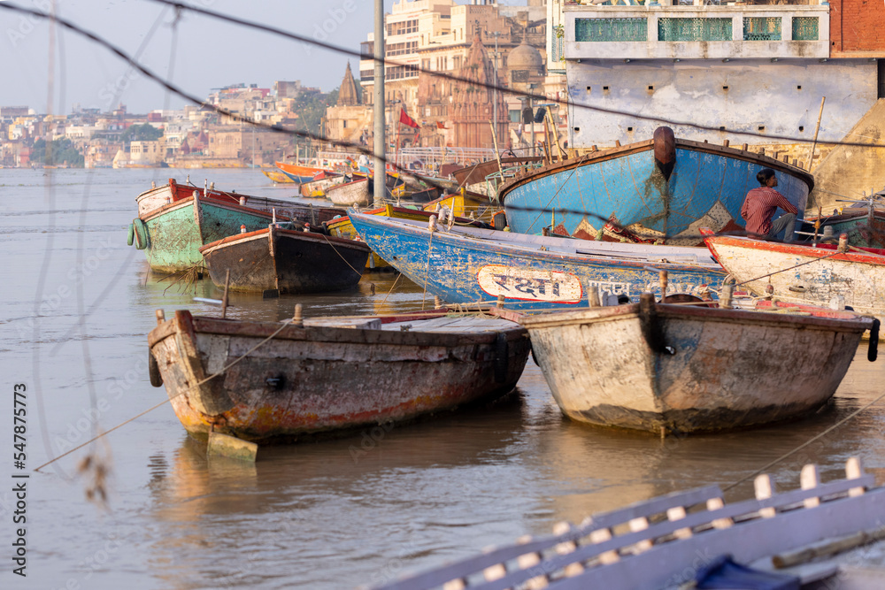 Barges moored in the ghats of Varanasi (India) Stock Photo | Adobe Stock