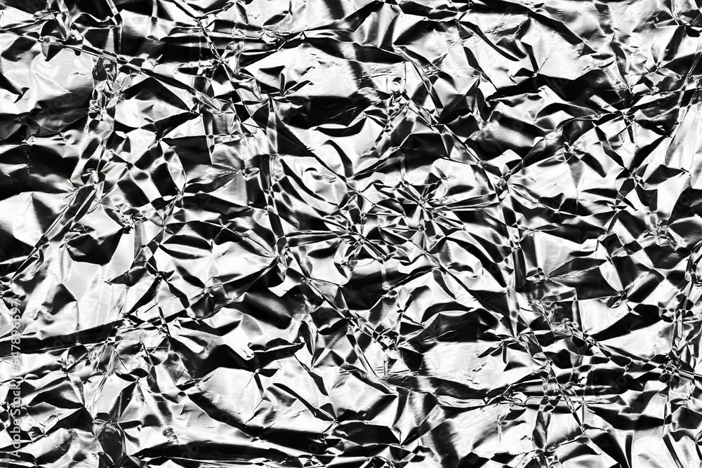 Crumpled silver kitchen foil pattern background. Futuristic metal ...