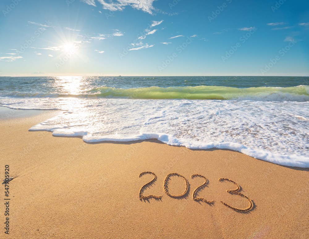 2023 year on the sea shore at day. Stock Photo | Adobe Stock