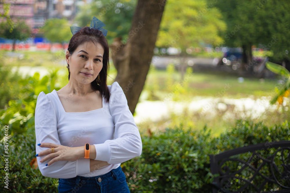 Beautiful asian woman age 40 years old with nature background outdoors ...