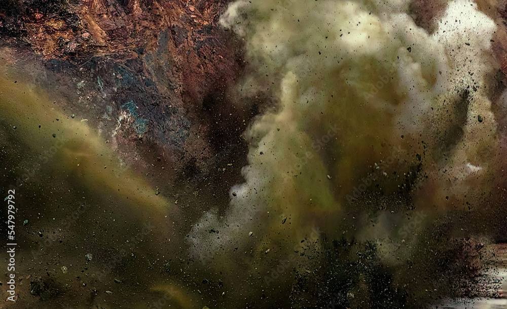 Dust storm and rock particles during detonator blat on the mining site ...