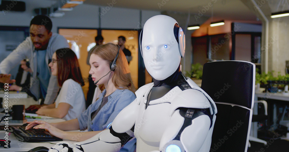 Digital transformation. Robot looking at camera in office. White device ...