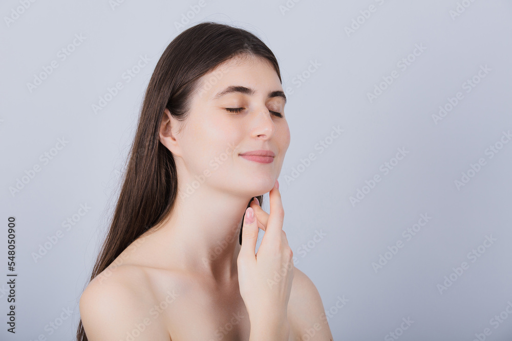 Closeup beautiful woman portrait, side view keeps finger to chin and ...