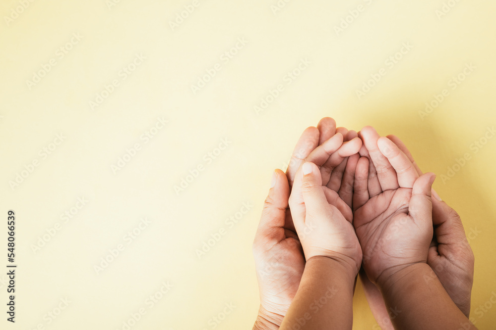 Closeup top view family hands stack palms studio shot isolated on ...