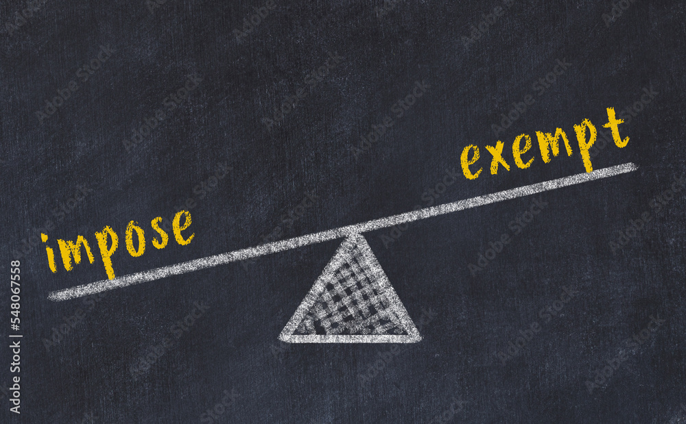 Chalk drawing of scales with words impose and exempt. Concept of ...