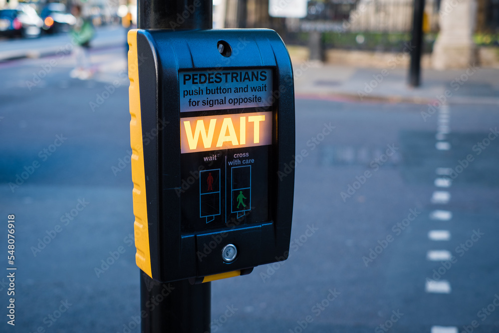 Pedestrian traffic light control button at crosswalk for safe road ...