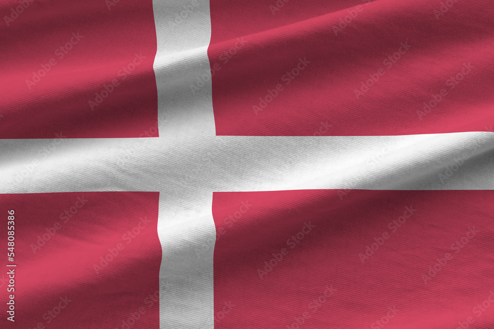 Denmark flag with big folds waving close up under the studio light ...