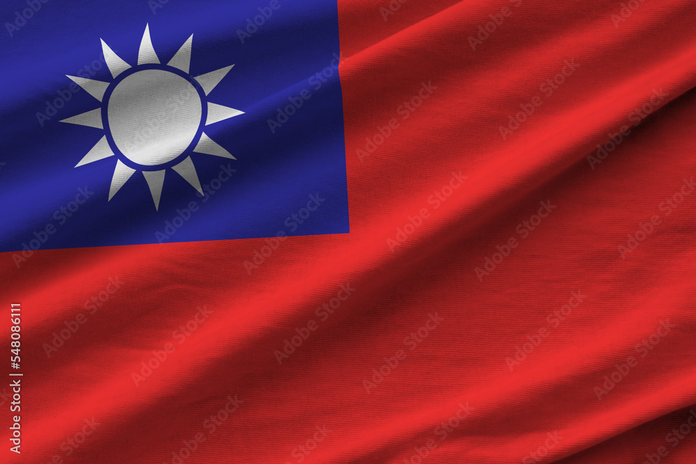 Taiwan flag with big folds waving close up under the studio light ...