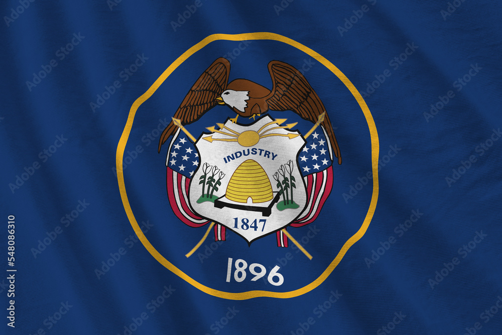 Utah US state flag with big folds waving close up under the studio ...