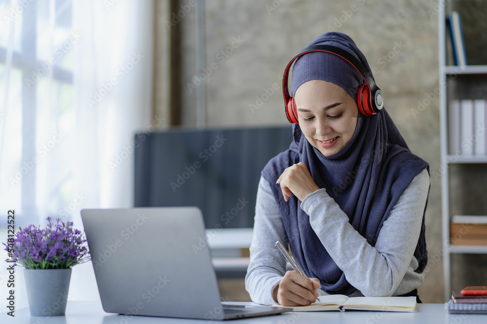 Muslim female student in hijab studying online with laptop Asian girl ...