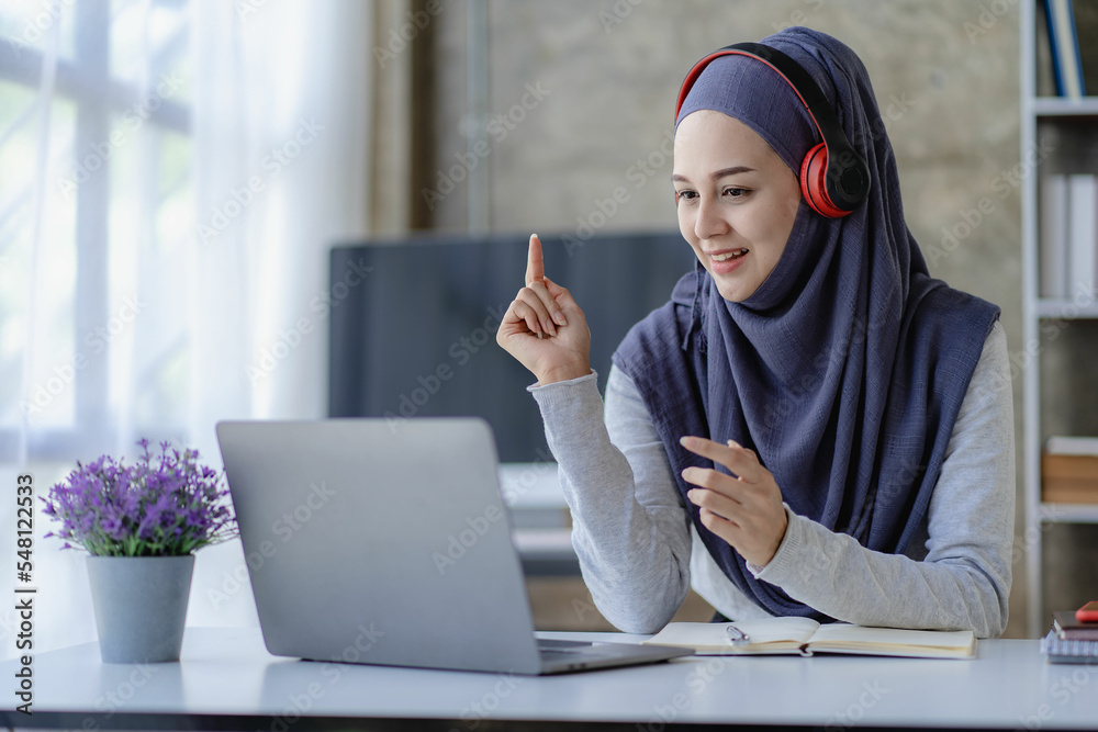 Muslim female student in hijab studying online with laptop Asian girl ...
