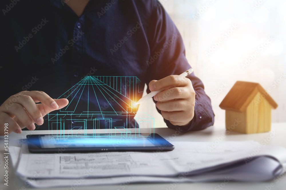 House plan design, house structure blueprint. Engineers use tablets to ...