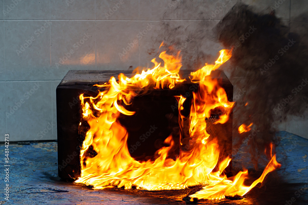 microwave oven on fire. the concept of fire in the kitchen and ...