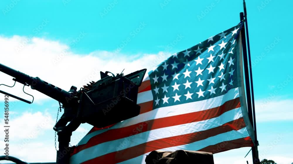 American flag flies behind machine gun in 4K 素材庫影片 | Adobe Stock