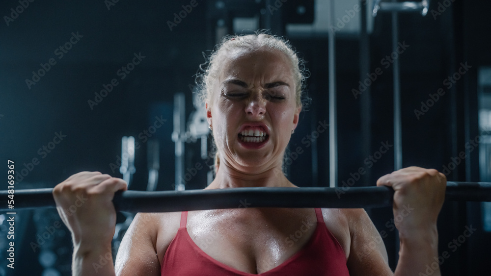 The Portrait of A Young Athletic Woman Pushing Through the Exercise ...