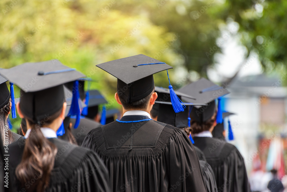 Back side view a group higher education graduation of graduates during ...