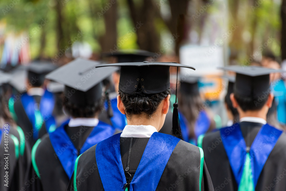 Back side view a group higher education graduation of graduates during ...