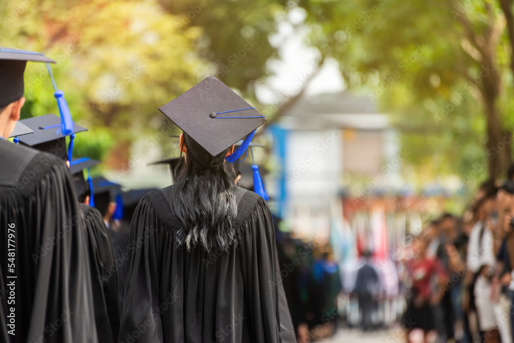 Back side view a group higher education graduation of graduates during ...