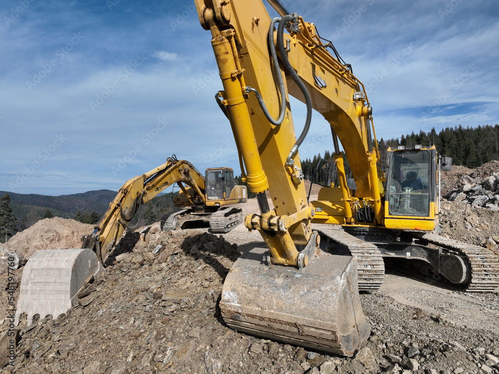 Industrial mine excavators are digging the soil in the construction ...