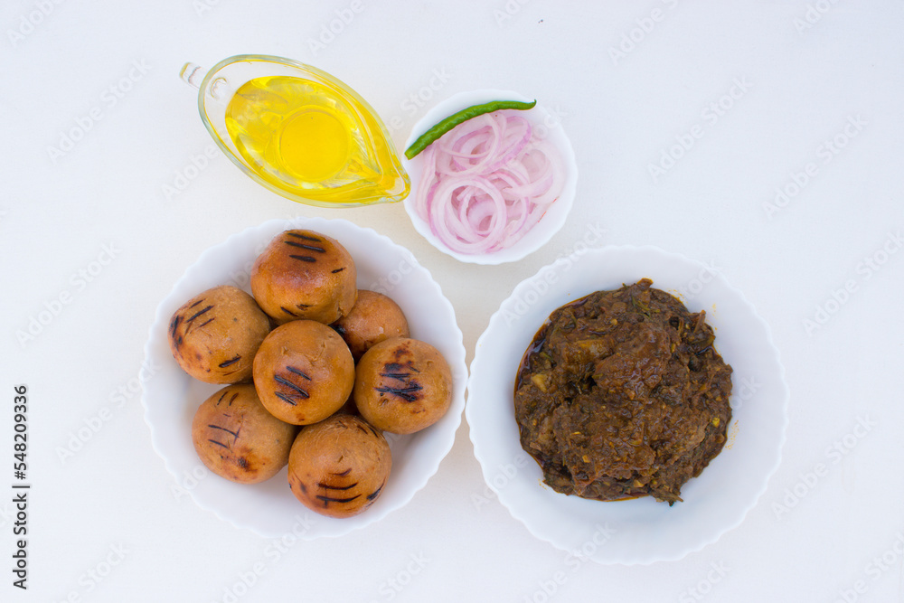 Litti with chicken, ghee and onion ring. It is popular in Bihar, Uttar ...