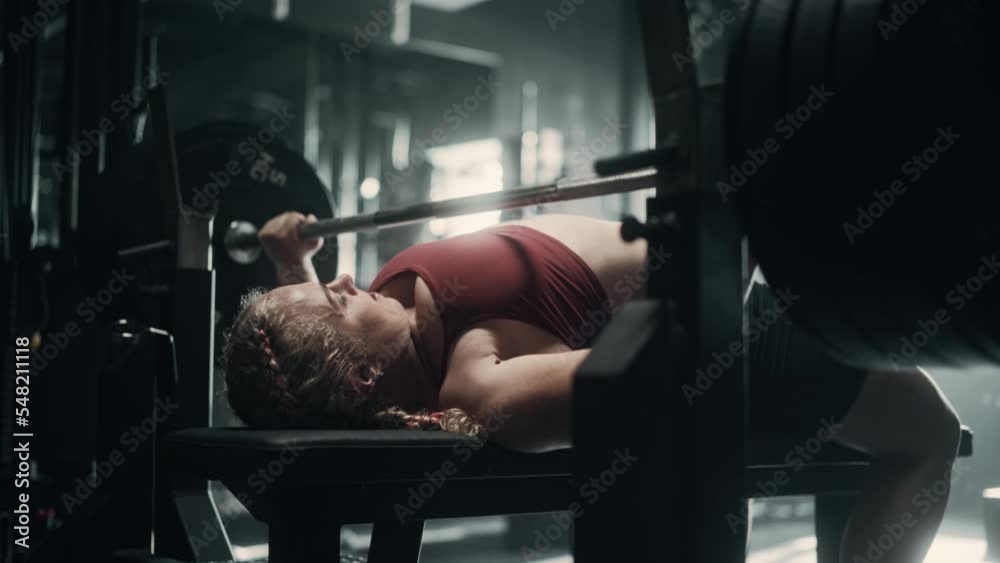 A Determined Female Powerlifter Finishing Her Workout Day in a Hardcore ...