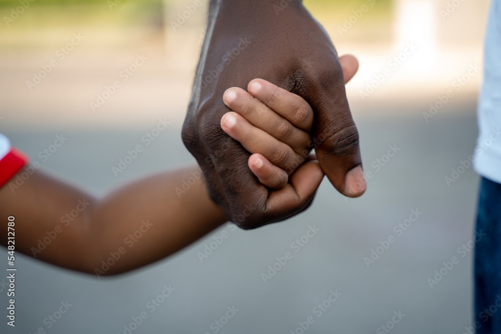 Two People Walking Hand In Hand