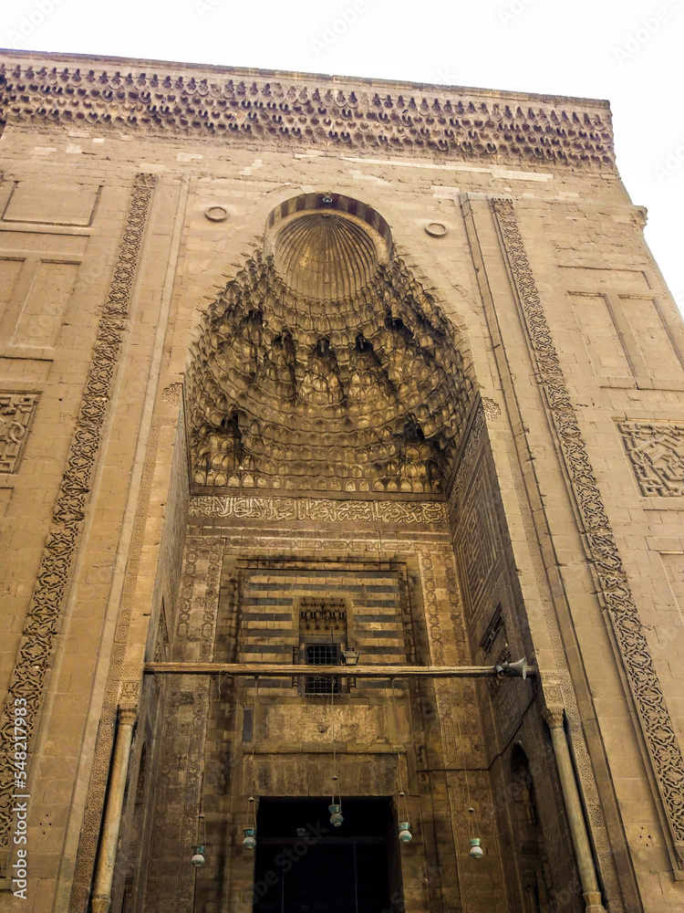 The entrance portal of Sultan Hassan Mosque with carved honeycomb ...