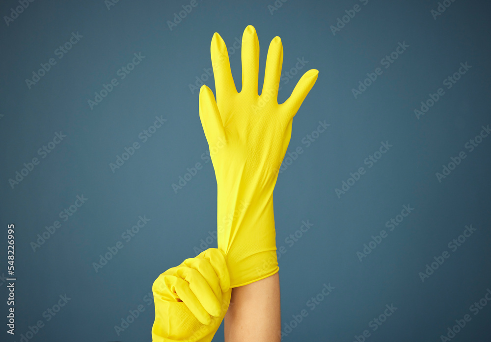 Cleaning, yellow rubber glove and hand on studio background for cleaner ...