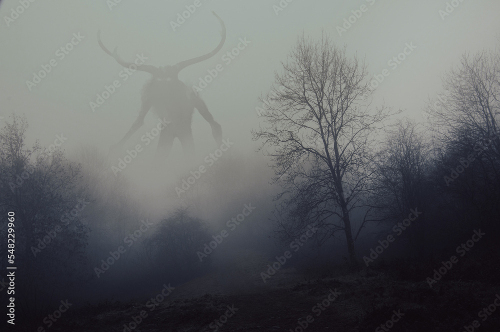 A fantasy concept of a horned god like monster. Looking across a forest ...