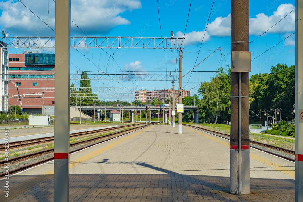 Low platform for trains at the station in a small town. Railway ...