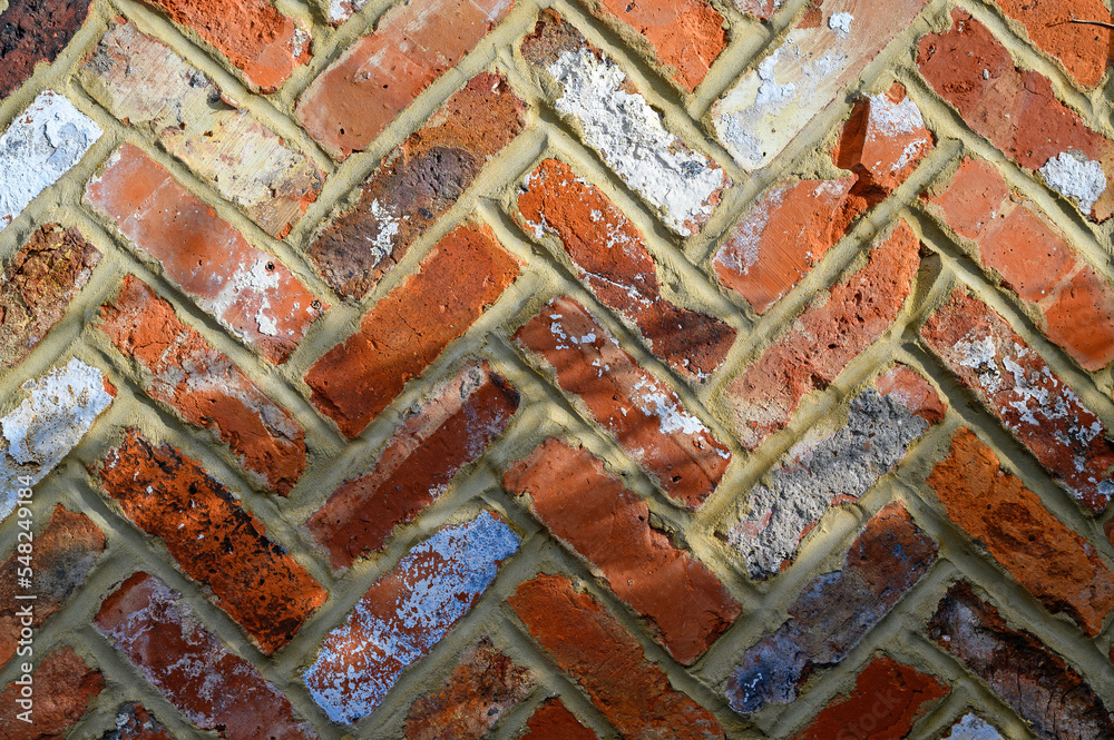 Red brick wall with herringbone design. This brick wall has an ...