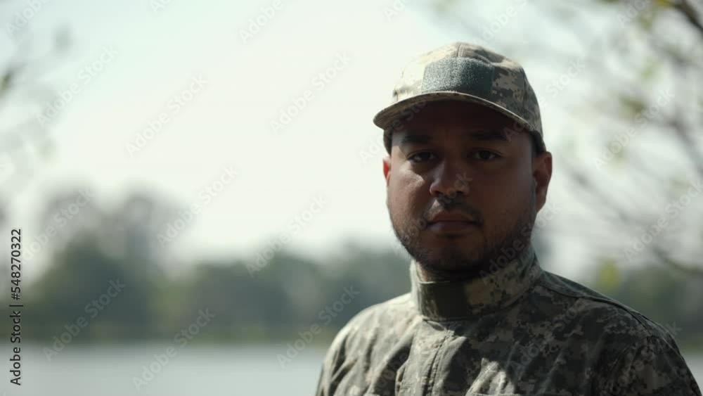 Serious man in military uniform special forces soldier standing against ...
