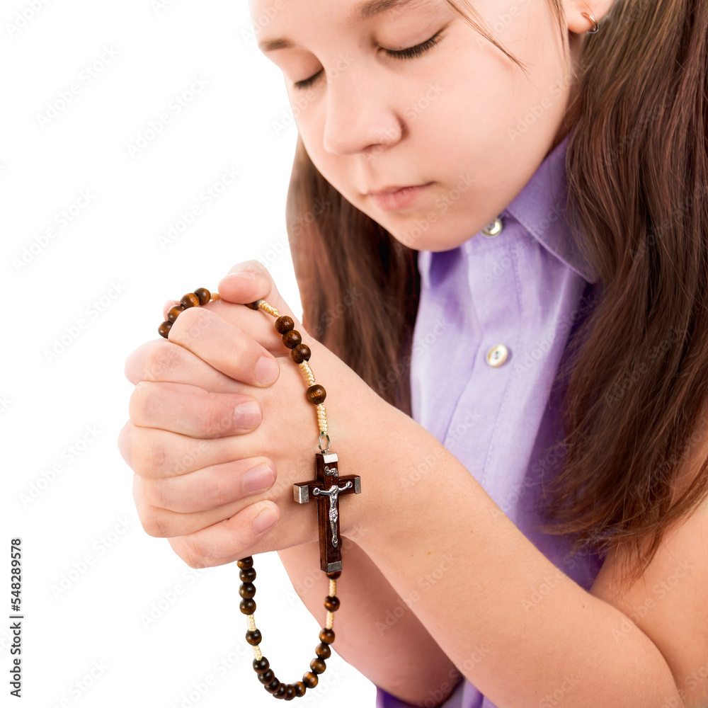 girl child praying holding wooden rosary in hands on close up Stock ...