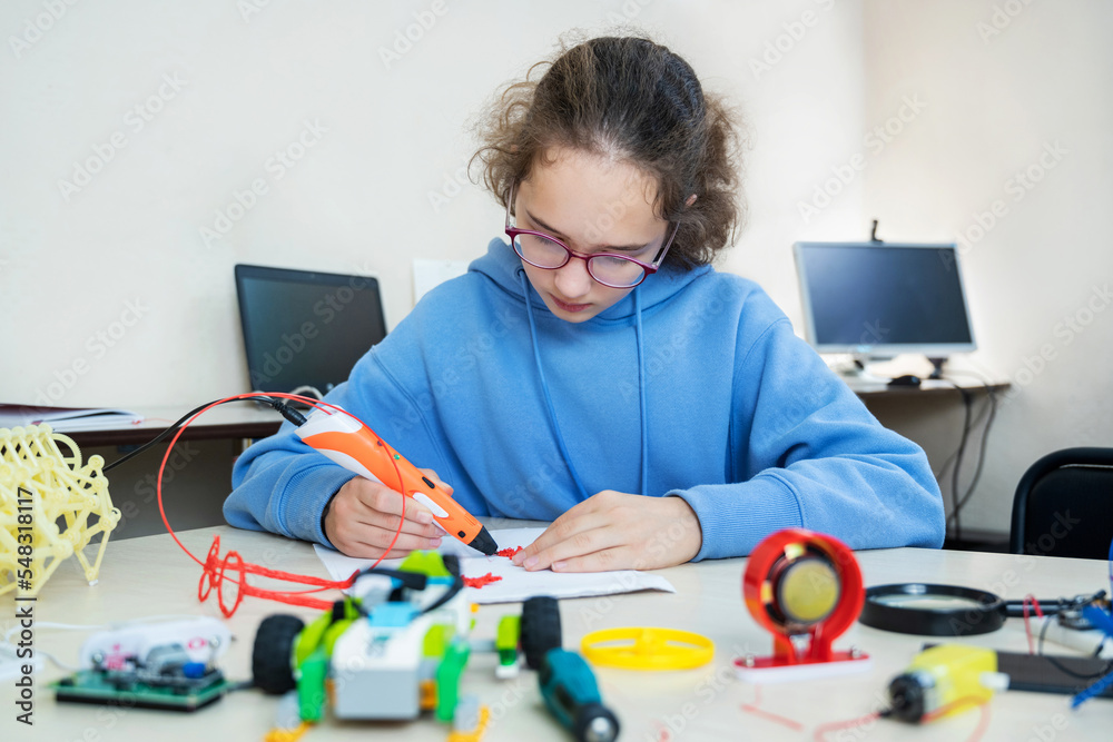 Teenager girl creating with 3d printing pen new object. STEM education ...
