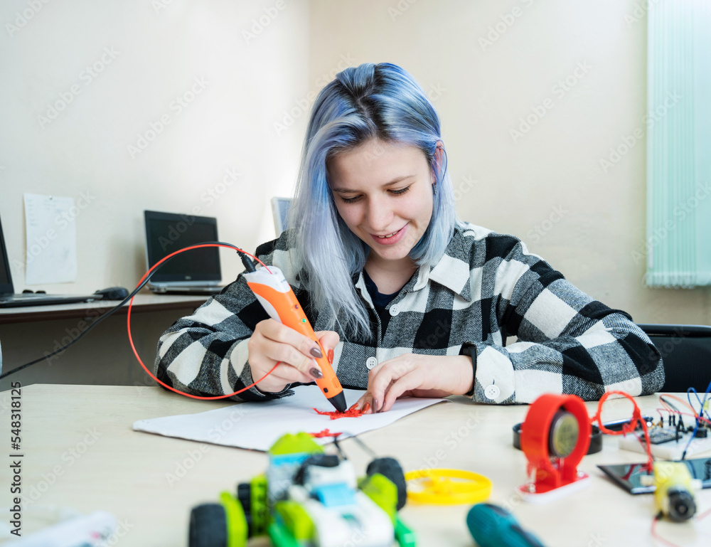 Teenager girl creating with 3d printing pen new object. STEM education ...