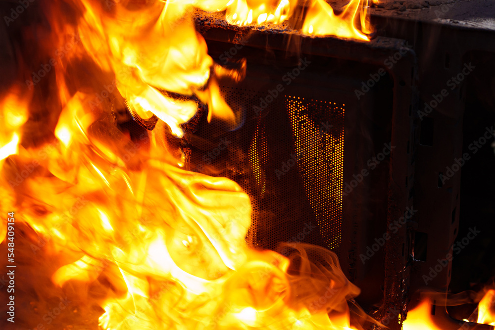 fire and molten plastic on a black background. the concept of fire in ...